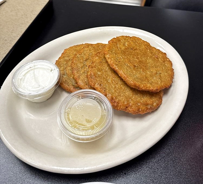 Golden-brown potato pancakes with sides of sour cream and applesauce&mdash;the perfect supporting actors to your sandwich superstar.