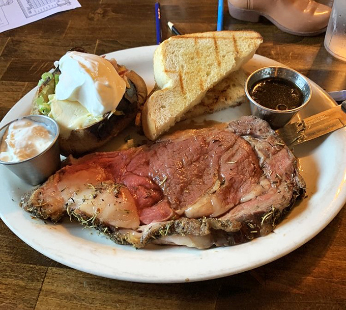 Prime rib that's been introduced to heat just long enough to blush, served alongside a baked potato that's practically begging to be devoured.