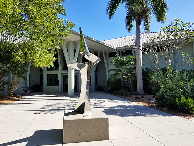 A public library with architecture that says "books are still cool" and a sculpture that reminds you art belongs everywhere, even between the mystery and biography sections.