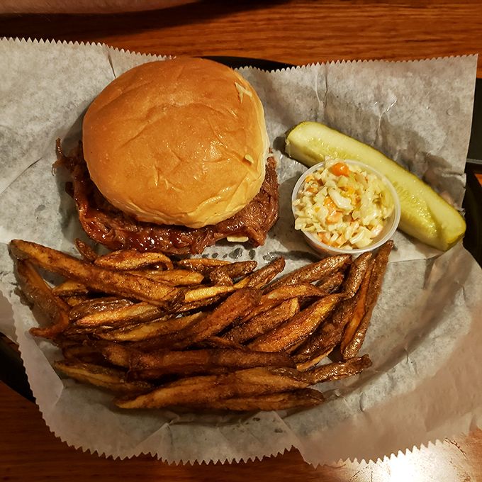 A pulled pork sandwich that doesn't need fancy tricks to impress &ndash; just honest flavor and perfect execution. Those fries look hand-cut and heaven-sent. 