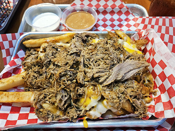 Pulled pork piled high atop cheese fries&mdash;a creation that makes you wonder if the chef somehow read your most indulgent food diary entries.