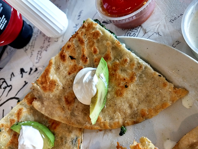 A quesadilla that doesn't mess around&mdash;crispy, cheese-laden, and adorned with fresh avocado and sour cream. Tex-Mex simplicity elevated to an art form.