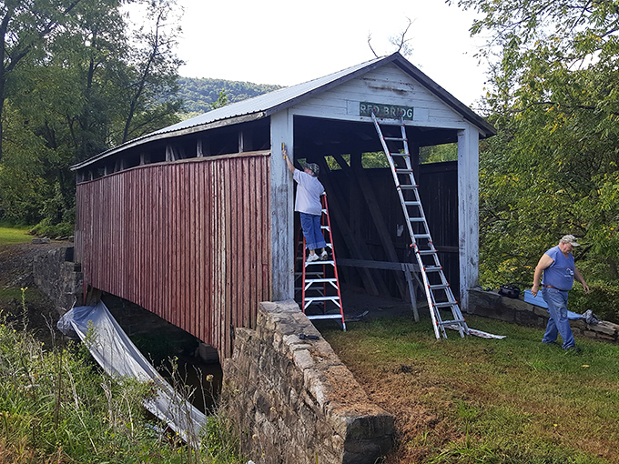 Preservation in action—dedicated volunteers work to maintain this wooden treasure, ensuring future generations can experience Pennsylvania's transportation heritage.