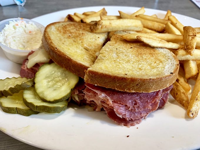 A classic Reuben sandwich that towers with corned beef and sauerkraut&mdash;the kind that requires both hands and several napkins to properly enjoy.