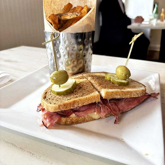 The sandwich that bridges breakfast and lunch&mdash;pastrami nestled between toasty rye with those house-made fries standing at attention in their metal sentry.