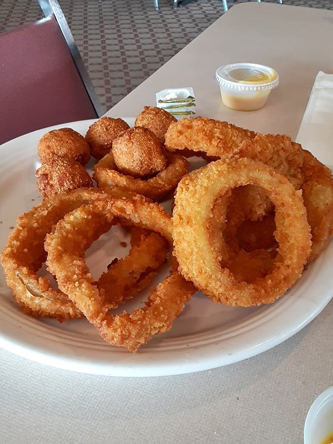 Onion rings and hush puppies that deserve their own fan club &ndash; golden-fried perfection that makes sharing a true test of character.