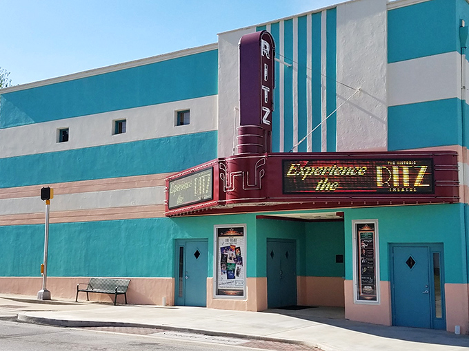 The Ritz Theatre's Art Deco marquee glows with retro charm. Where movie tickets don't require a small loan and popcorn comes with real butter.