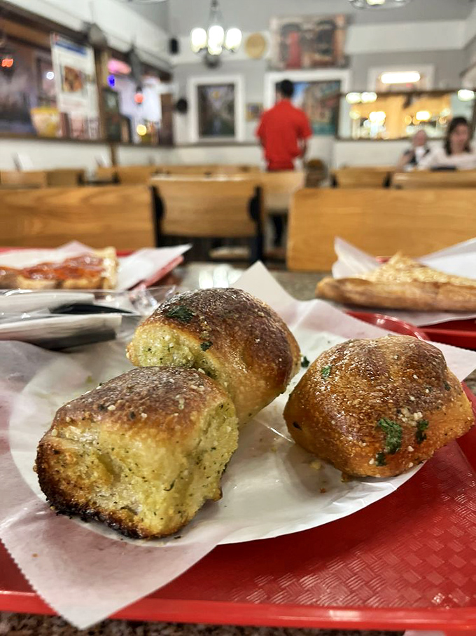 Garlic knots that could make a vampire reconsider his dietary restrictions&mdash;golden, glistening, and worth every bit of the subsequent breath mint. 