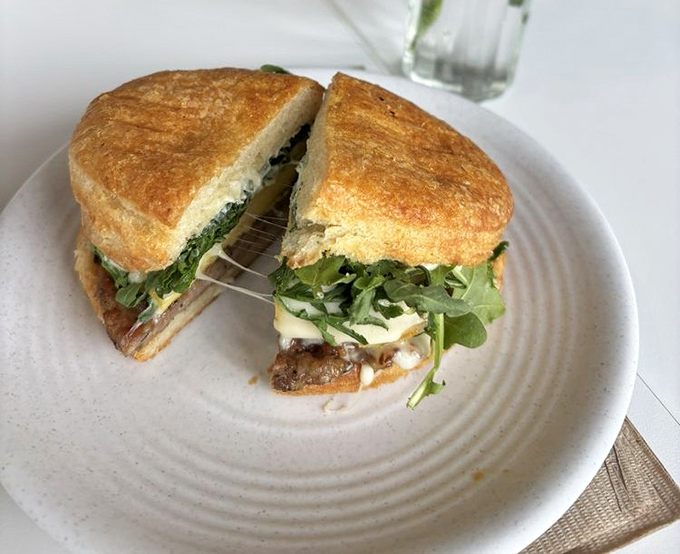 This sandwich has that "I can't believe this is breakfast" energy &ndash; melty cheese stretching dramatically like it's auditioning for a food commercial.