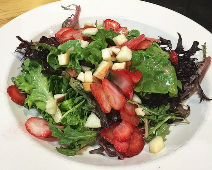 Even the salads at Bacon & Butter deserve attention. Fresh greens, strawberries, and apples create a colorful symphony that almost makes you forget about bacon. Almost.