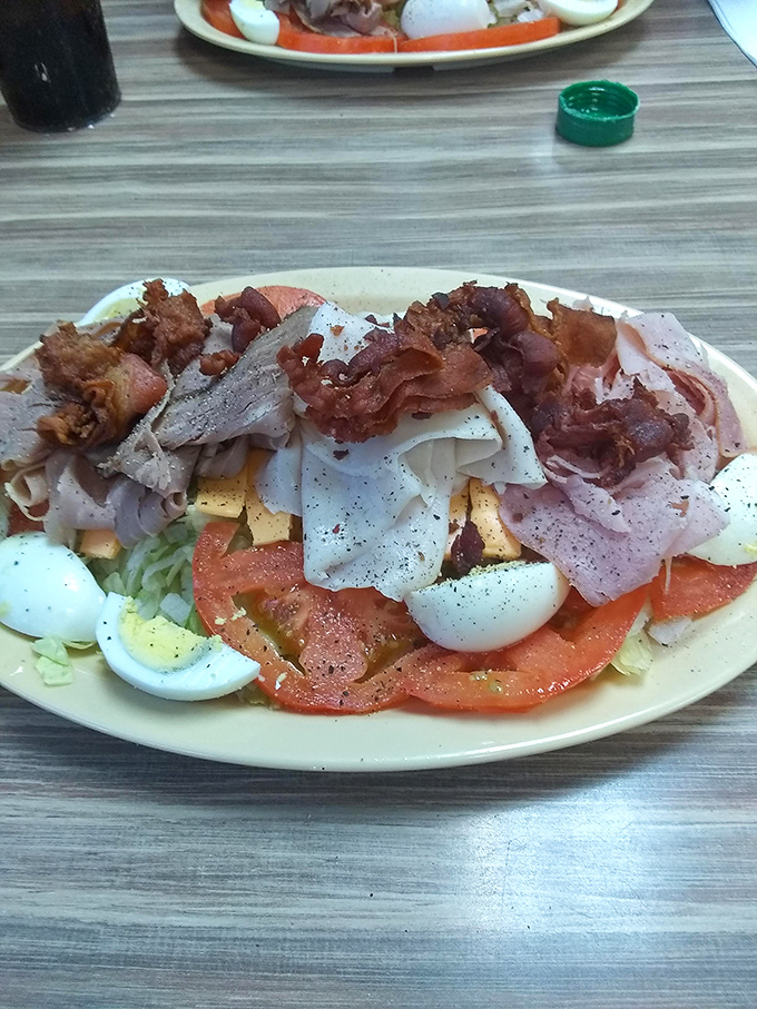Garden fresh meets New Orleans flair in this loaded salad where crispy bacon bits play hide and seek among the veggies.