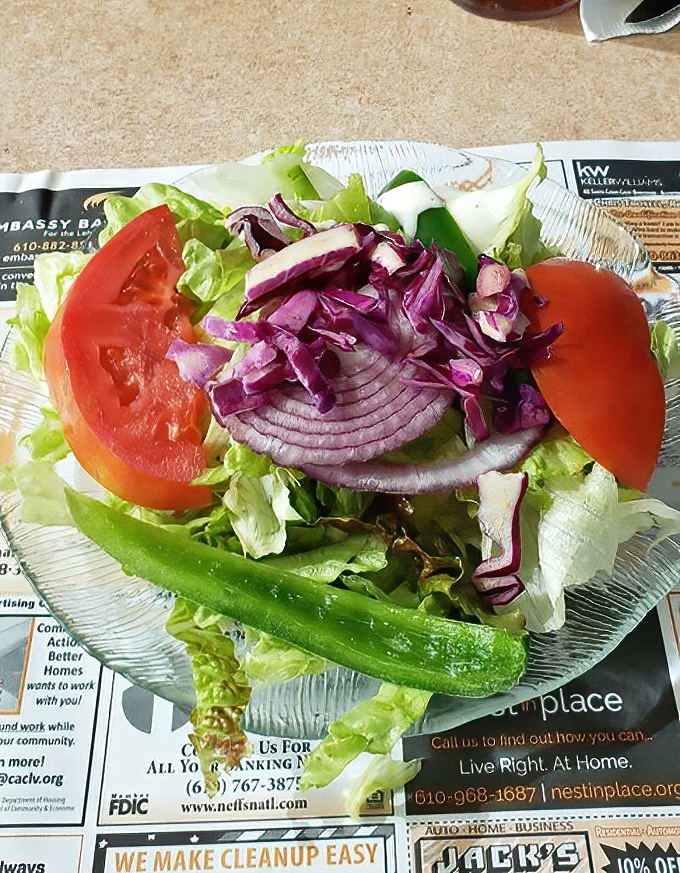 Even the side salad gets respect here &ndash; crisp lettuce, vibrant tomatoes, and purple onion slices that add color to your obligatory vegetable intake.
