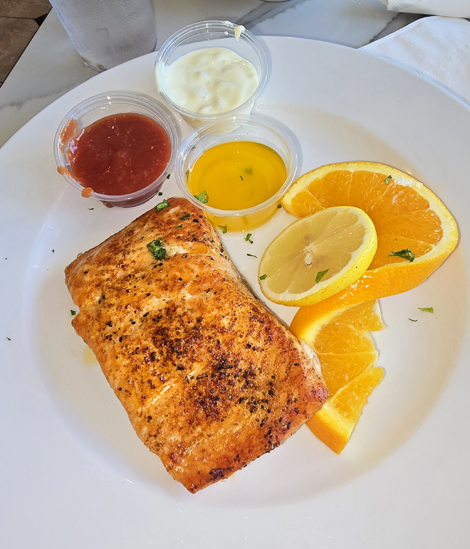 This salmon isn't just cooked &ndash; it's been treated with the respect a noble fish deserves, served with citrus that brightens every bite.