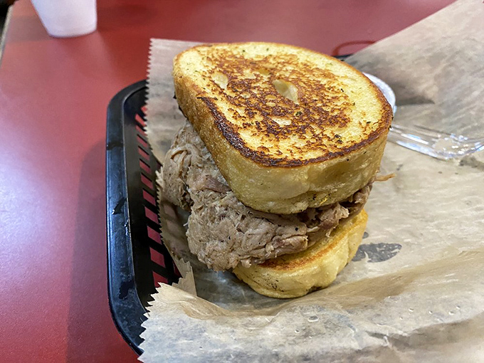 A sandwich built like a Jenga tower of meat, daring you to attempt eating it with dignity intact.