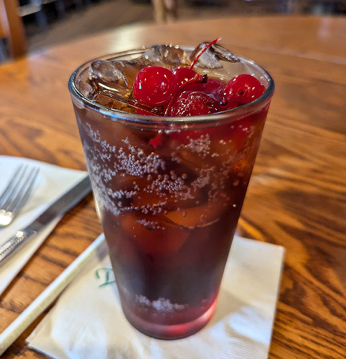 A ruby-red sangria topped with cherries &ndash; because sometimes a coastal meal requires a proper toast to the Pacific just down the road.
