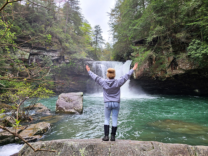Arms outstretched at Savage Falls&mdash;the universal pose of someone who's found their happy place. Water therapy at its most spectacular.