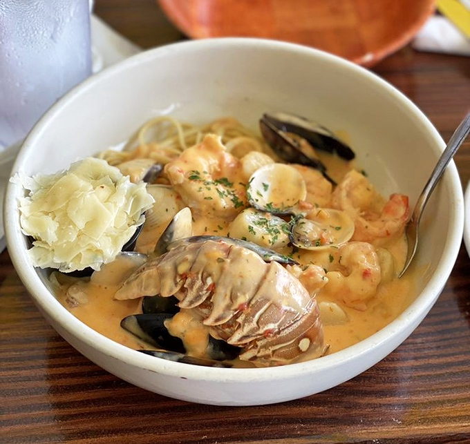 A seafood medley swimming in creamy broth. This isn't just soup&mdash;it's a maritime celebration in a bowl. 
