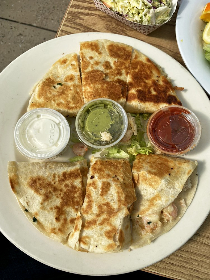 Quesadillas reimagined by Neptune himself &ndash; where cheese meets seafood in a crispy, golden tortilla embrace that defies tradition.
