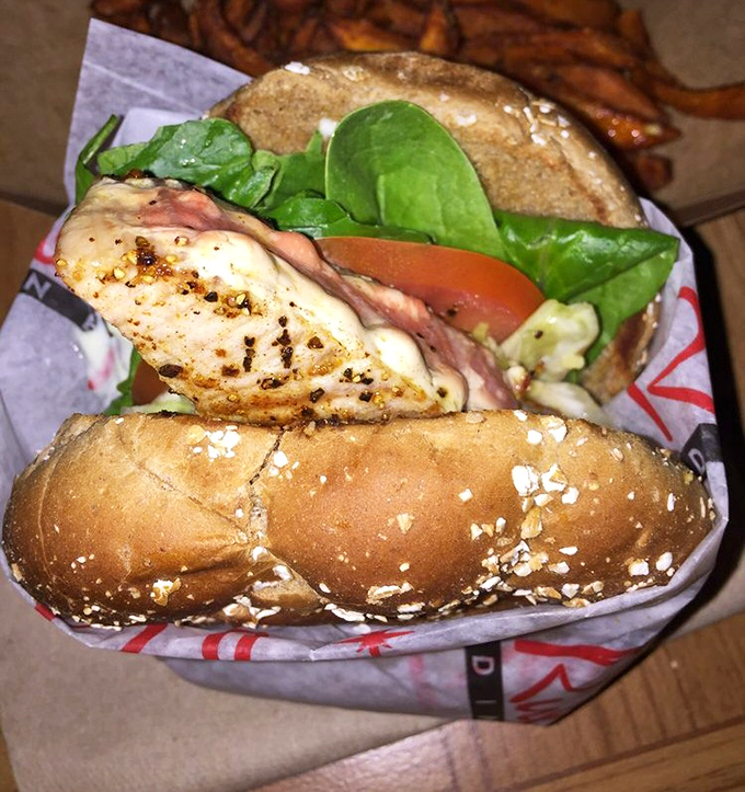 The ahi sandwich&mdash;where health food meets indulgence in a perfect coastal compromise. Those sweet potato fries aren't just a side, they're a statement.