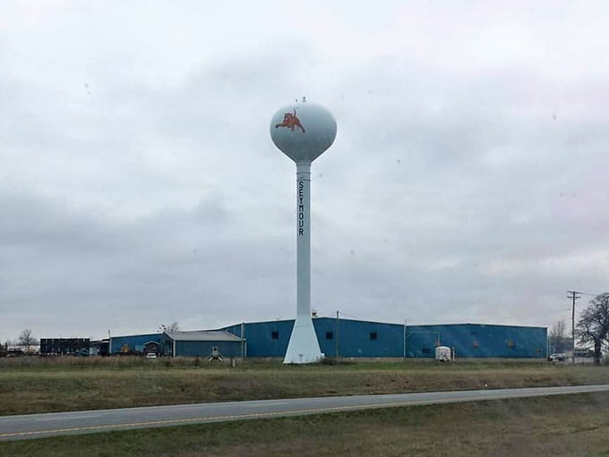 The town water tower stands sentinel over the landscape, a landmark that says "you're home" to locals returning from travels near and far.