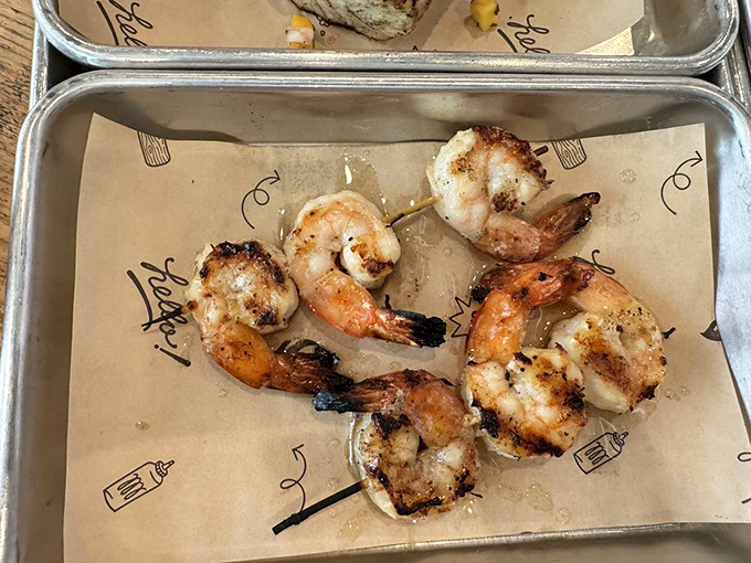 Grilled shrimp skewers prove that seafood deserves smoke too &ndash; charred just enough to make you forget you're at a barbecue joint.