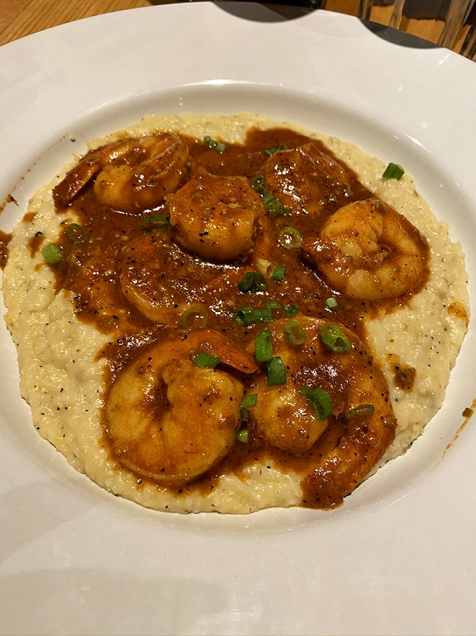 Shrimp and grits: where plump Gulf crustaceans lounge on a creamy bed, living their best afterlife.