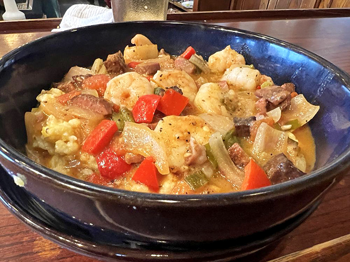 Shrimp and grits that would make a Southerner weep with joy. That rich broth isn't just liquid&mdash;it's a carefully crafted flavor delivery system.