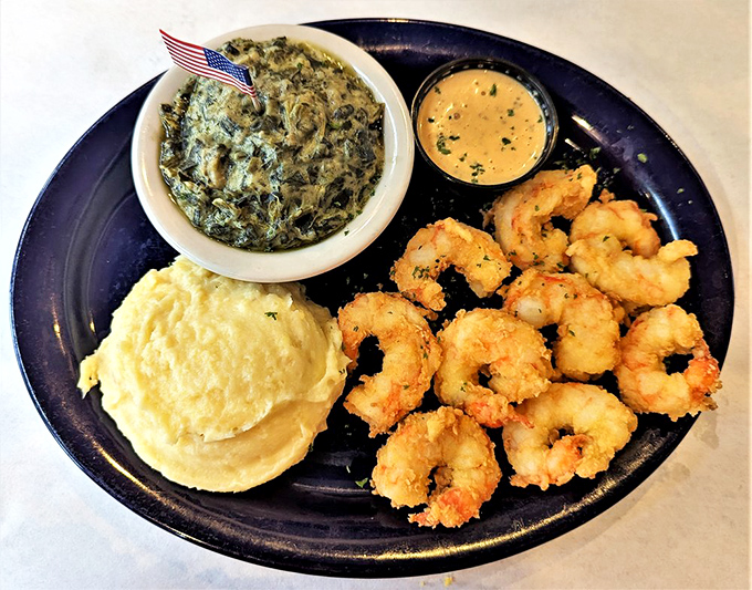 Golden-fried shrimp that would make Poseidon himself abandon the sea. The creamy sauce and sides create a triumvirate of Southern comfort.
