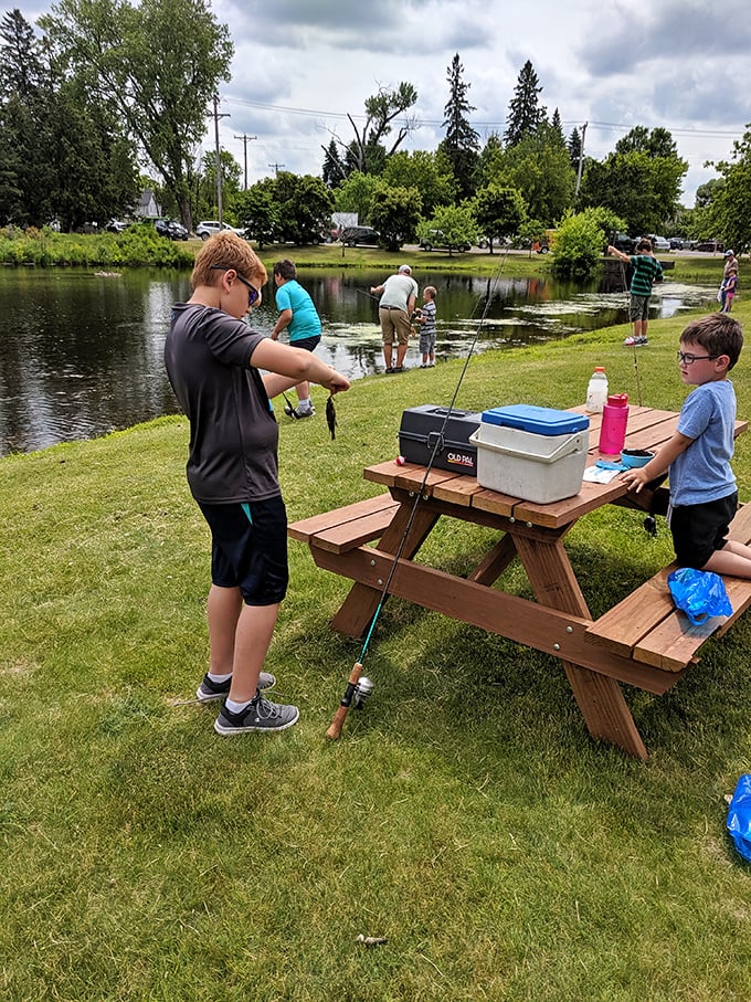 Nothing says "childhood summer memory in the making" like kids learning to fish at a local pond, tackle box and patience at the ready.