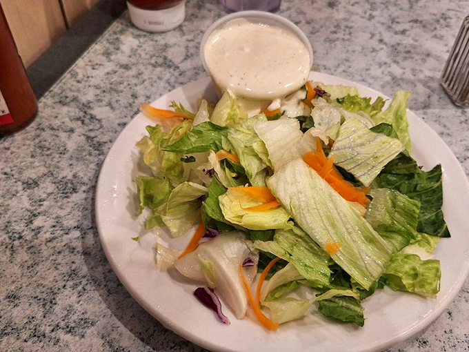 Even the side salad gets respect here&mdash;fresh, crisp, and unapologetically simple, like vegetables showing up to a formal event.