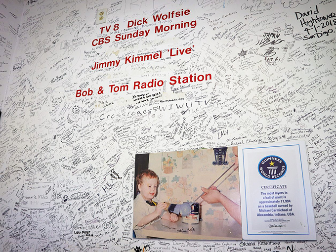 The wall of fame showcases media appearances that have spread the gospel of paint accumulation to the masses.