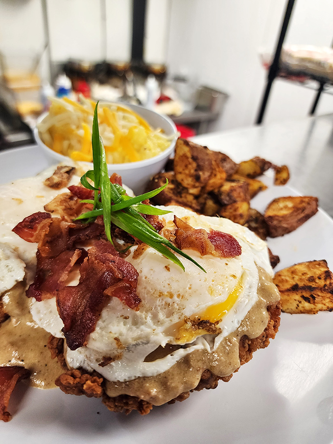When breakfast gets dressed for dinner &ndash; a perfectly fried chicken throne atop a gravy-laden biscuit with an egg crown.