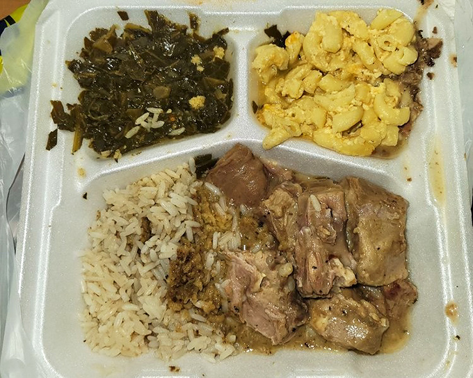 These smothered rib tips with rice, collards, and mac and cheese aren't just a meal - they're edible proof that patience in cooking pays off deliciously.