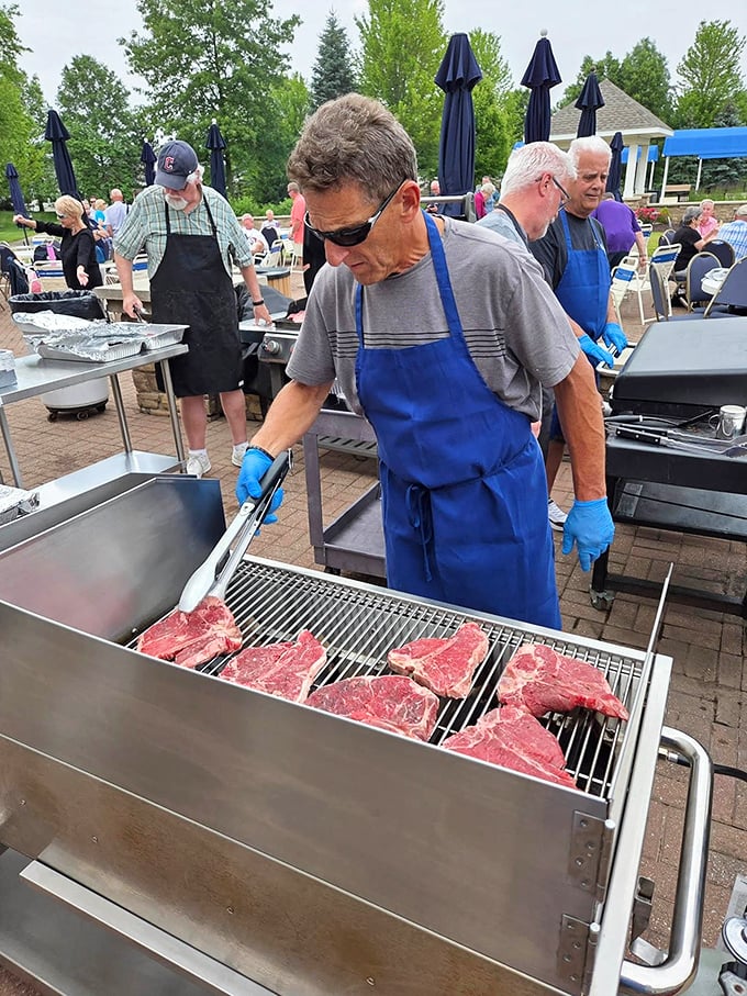Nothing builds community like food! Residents man the grills at one of many social gatherings that pepper the Pioneer Ridge calendar.