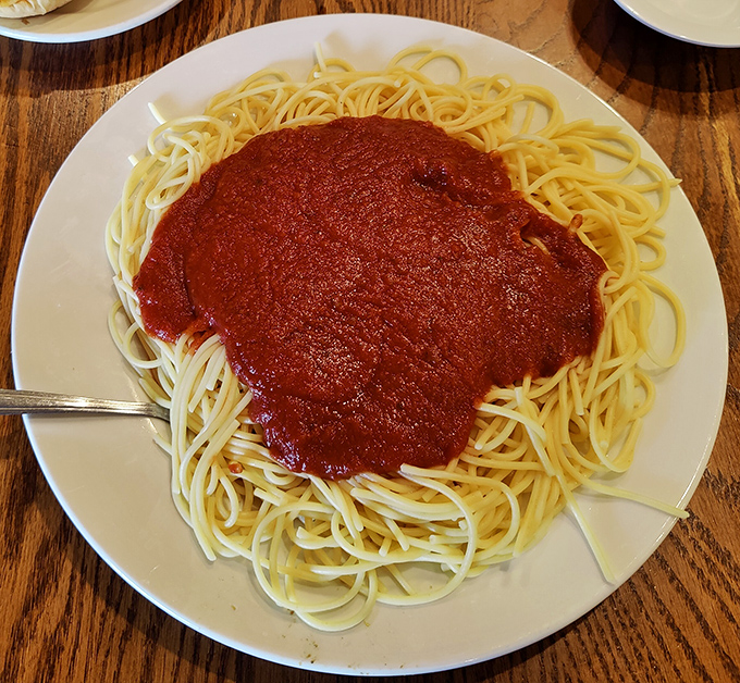 Spaghetti with sauce ladled on with the generosity of someone who learned to cook from their grandmother. No measuring cups were harmed in the making of this dish.