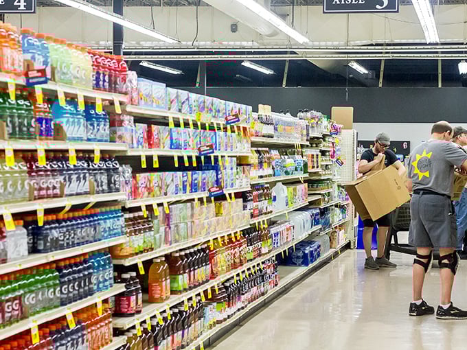 Shoppers navigate aisles of beverages and snacks, proving Salt & Light isn't just about secondhand treasures&mdash;it's a one-stop community resource.