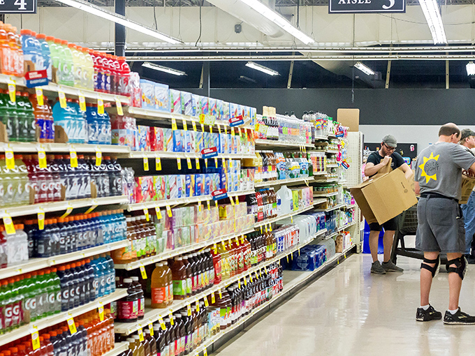 Shoppers navigate aisles of beverages and snacks, proving Salt & Light isn't just about secondhand treasures&mdash;it's a one-stop community resource.