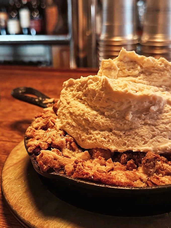 The strawberry crumble provides a sweet finale that perfectly caps off this rustic mountain dining adventure experience.