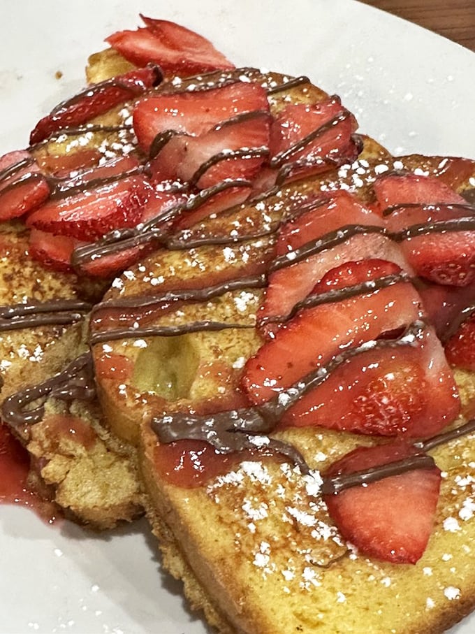 Strawberry Nutella French Toast that doesn't just satisfy your sweet tooth &ndash; it throws it a parade complete with powdered sugar confetti.