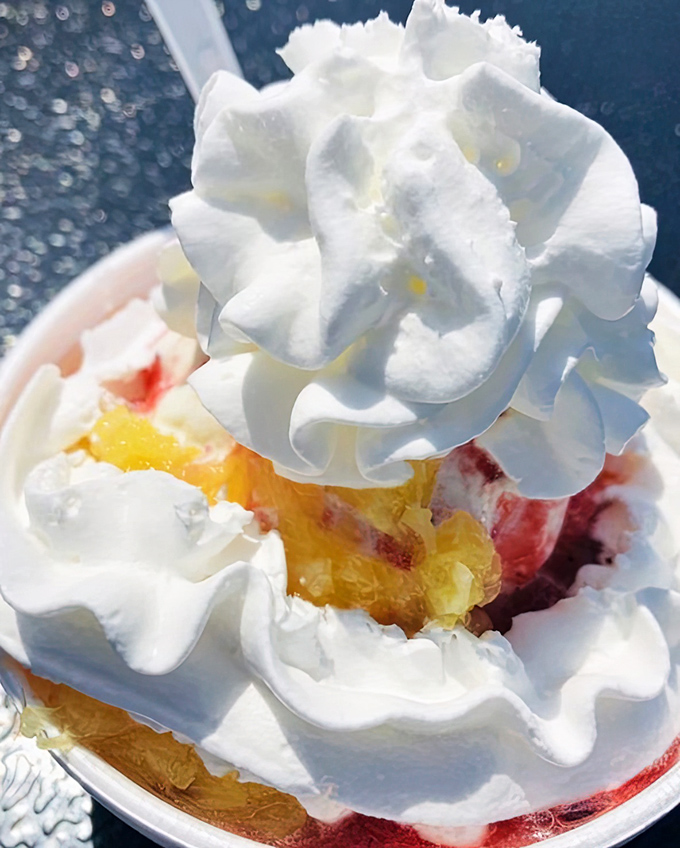 Behold the strawberry pineapple sundae&mdash;a mountain of whipped cream atop fruity treasures hiding below, like a delicious geological wonder waiting to be excavated.