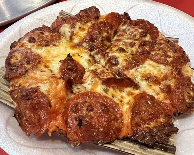 The Super Cheese & Pepperoni doesn't just suggest extra toppings – it insists on them, creating a pizza that's gloriously unapologetic about its excess.