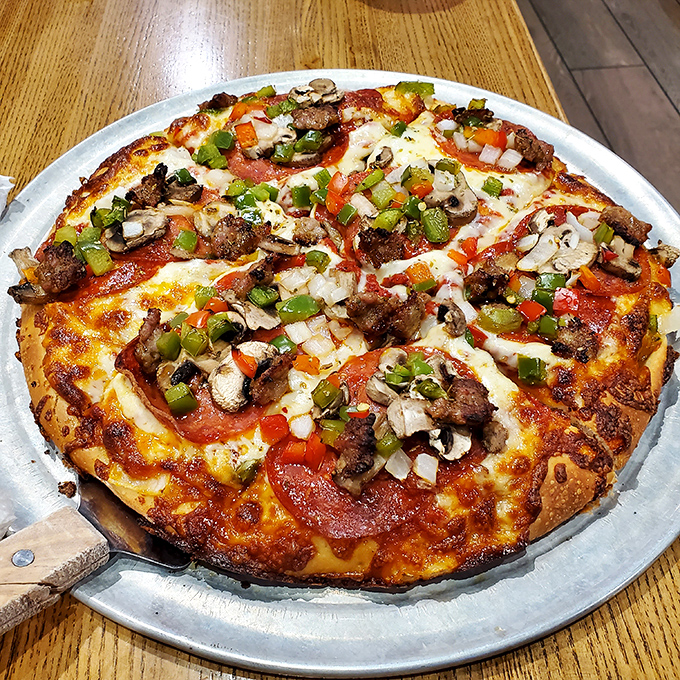 A pizza that doesn't just have toppings but wears them like medals of honor &ndash; each vegetable and meat precisely placed for maximum flavor impact.