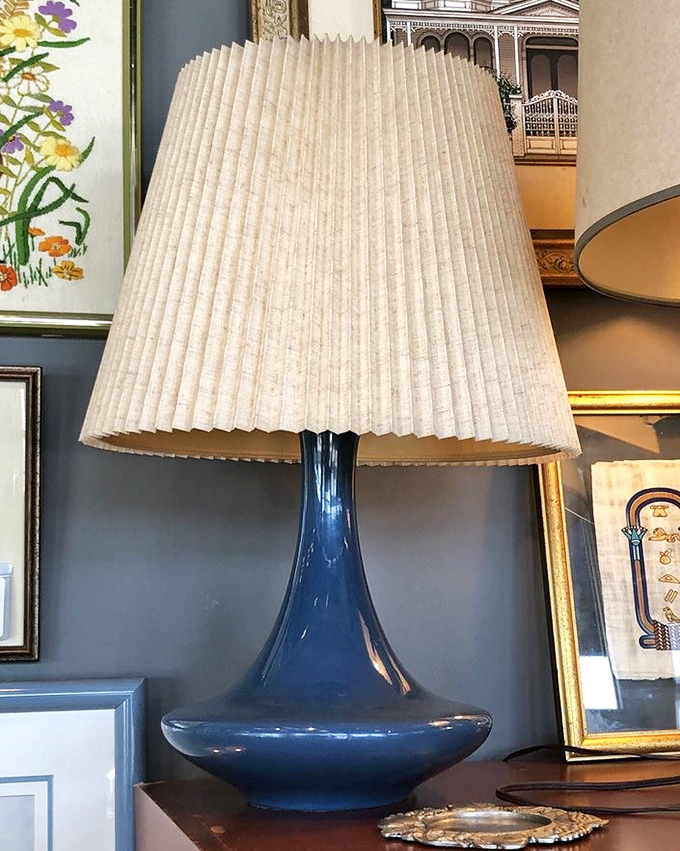 That blue lamp isn't just lighting up a room&mdash;it's lighting up a design conversation. Mid-century modern meets Florida sunshine in perfect harmony.