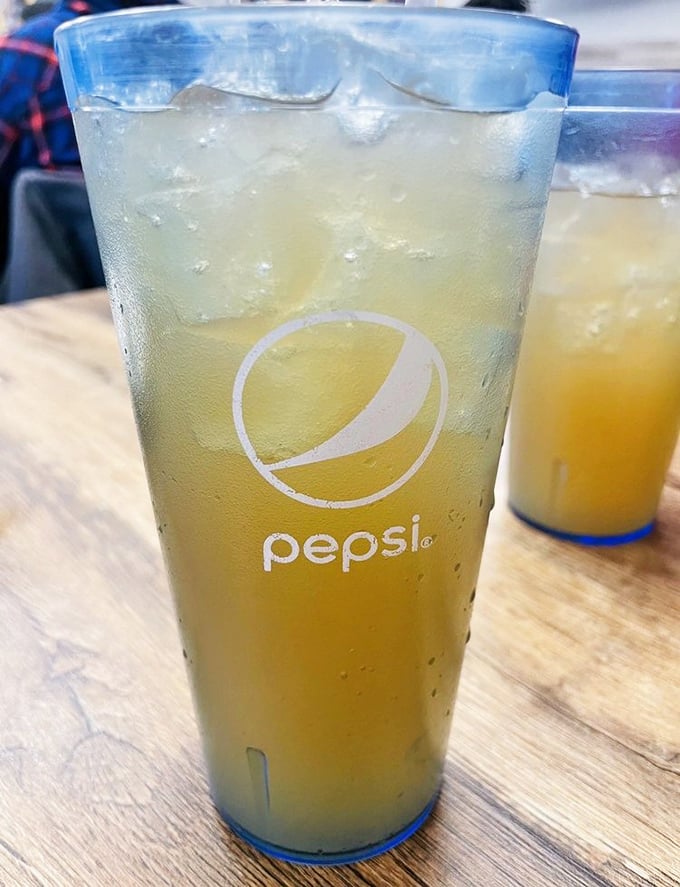 Sweet tea in a Pepsi glass&mdash;the unofficial state beverage of the South arrives properly chilled and ready to cut through rich flavors.