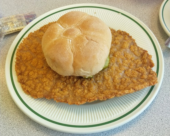 This tenderloin has been pounded into submission and fried to a golden state of nirvana that extends well beyond the boundaries of its modest bun.