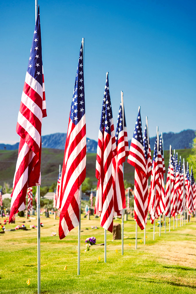 The Avenue of Flags transforms ordinary ground into sacred space. Small towns remember their heroes without needing Hollywood production values.