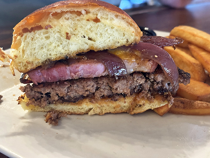 The Slab Burger doesn't just satisfy hunger &ndash; it conquers it with layers of beef, ham, and melty cheese on a pillowy brioche throne.