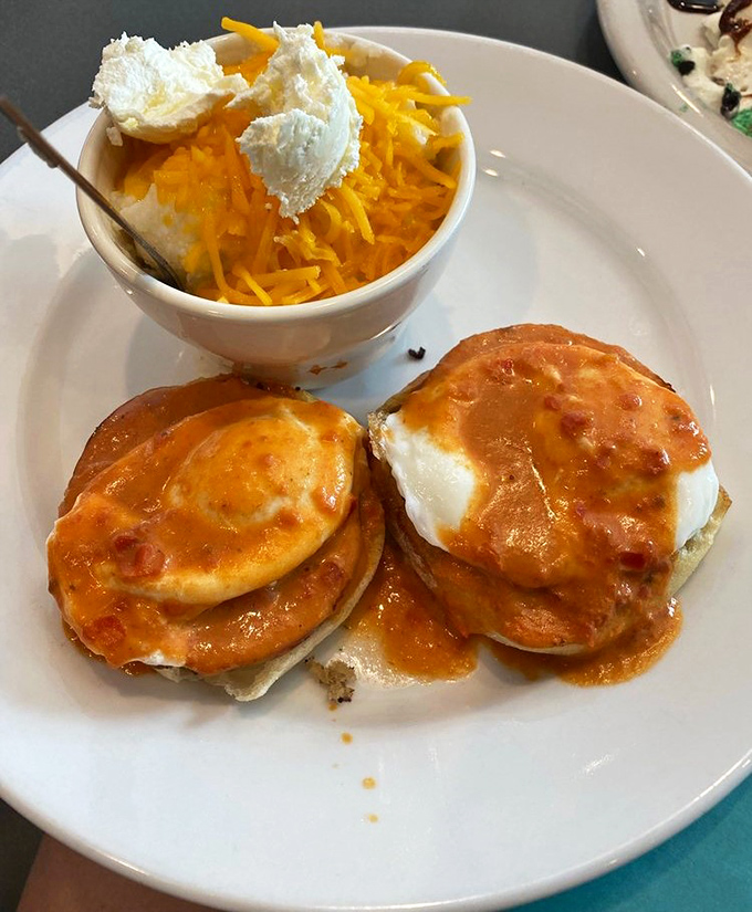 These aren't just eggs Benedict&mdash;they're breakfast royalty crowned with sauce. And those cheese grits? Southern comfort in a bowl.
