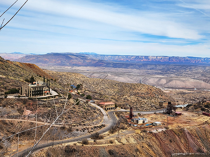 Mining equipment dots the landscape like industrial sculptures, reminders that Jerome's beauty was literally carved from necessity.