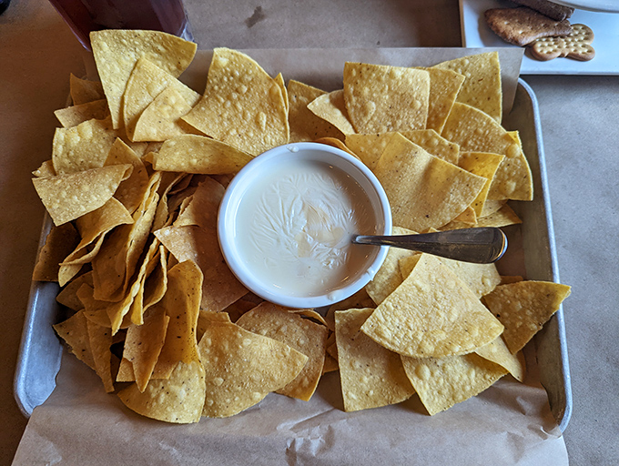 These aren't just tortilla chips&mdash;they're crispy vehicles engineered specifically for maximum queso transportation efficiency.